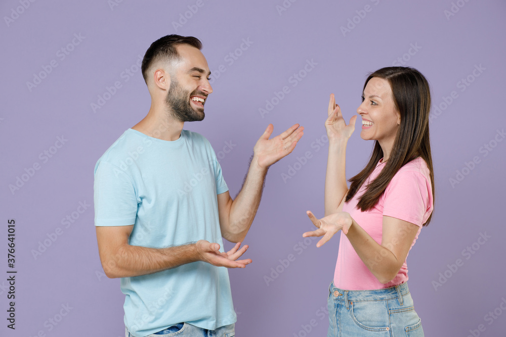 Smiling cheerful young couple two friends man woman wearing blue pink ...