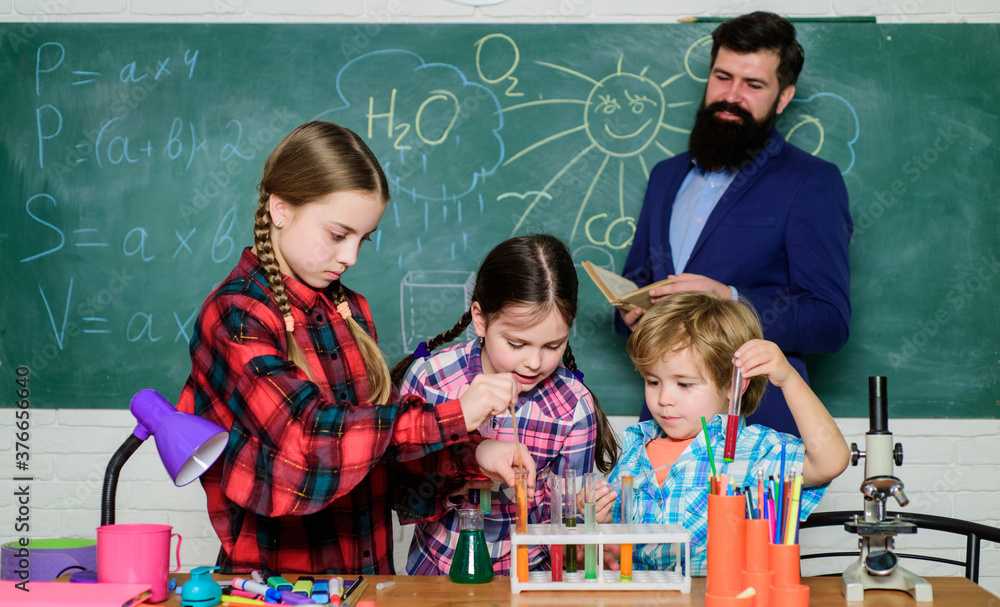 doing experiments with liquids in chemistry lab. chemistry lab. happy ...