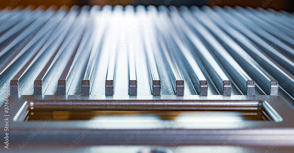 Fluted metal surface next to a control panel Stock Photo | Adobe Stock