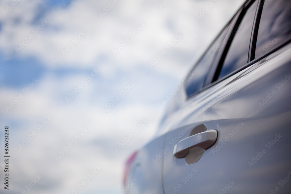 Bumper / Front of the white sports car.The car is on the road.Element ...