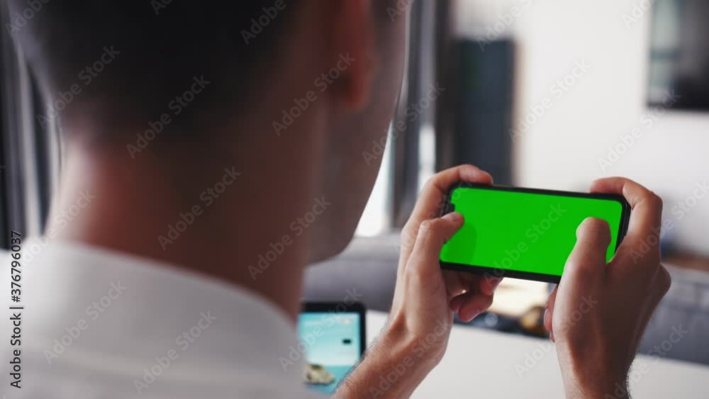 Rare Close-up of the unrecognizable Man Holding Green Screen Smartphone ...