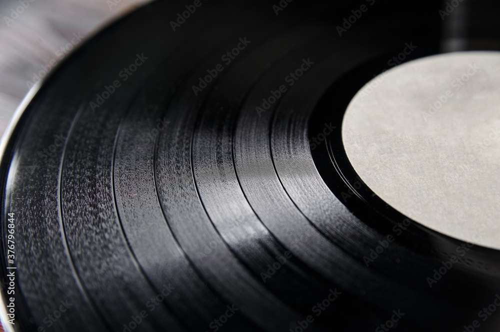 Segment of vinyl record with label showing the texture of the grooves ...