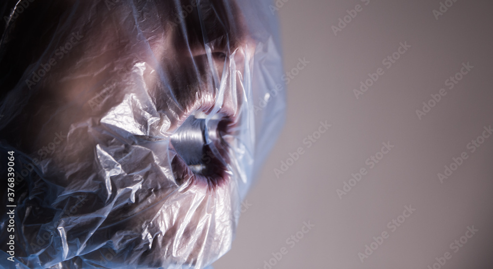 Human suffocating in plastic bag. Plastic pollution problem themed ...