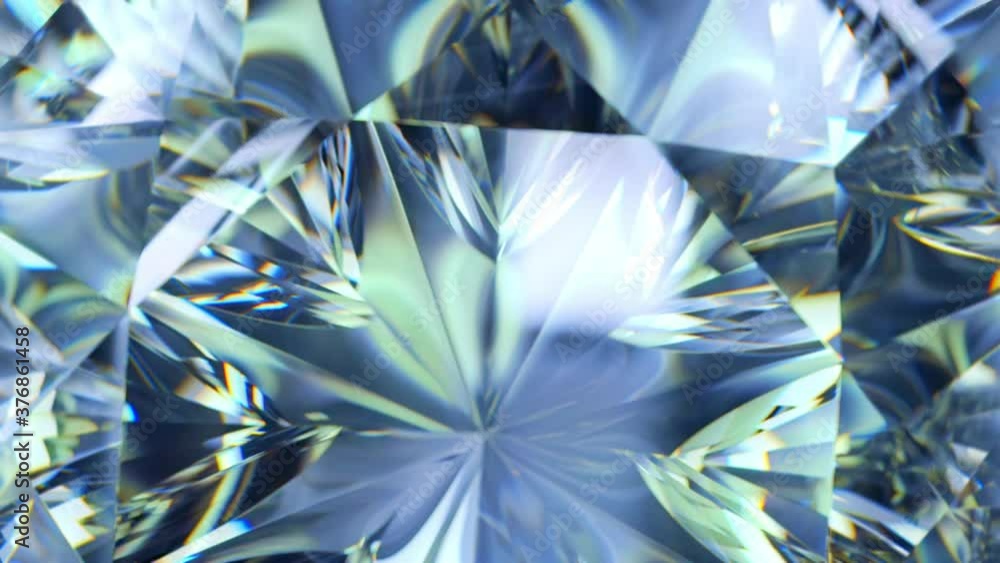 Close up of the faces of a rotating diamond showing the refraction and ...