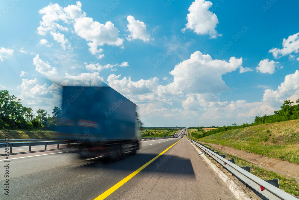 The truck is driving fast on the M4 don highway. Stock Photo | Adobe Stock