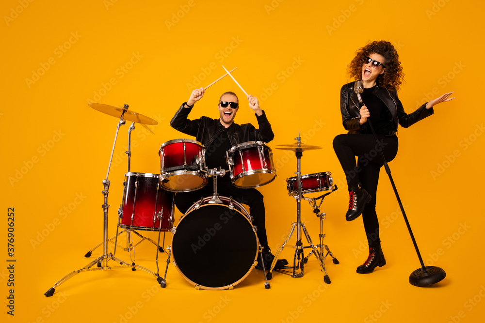 Full size photo of famous rock group guy plays instruments drum sticks ...