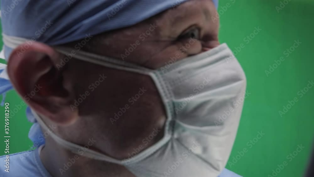 Psyched doctor closes the plastic bag with a dead body inside. Hospital ...