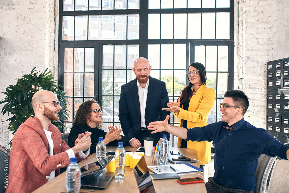 Group of joyful smiling happy people celebrate win with arms up ...
