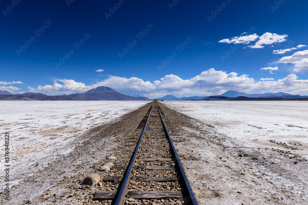 Train track across the Uyuni Salt flat, Altiplano, Bolivia Stock Photo ...