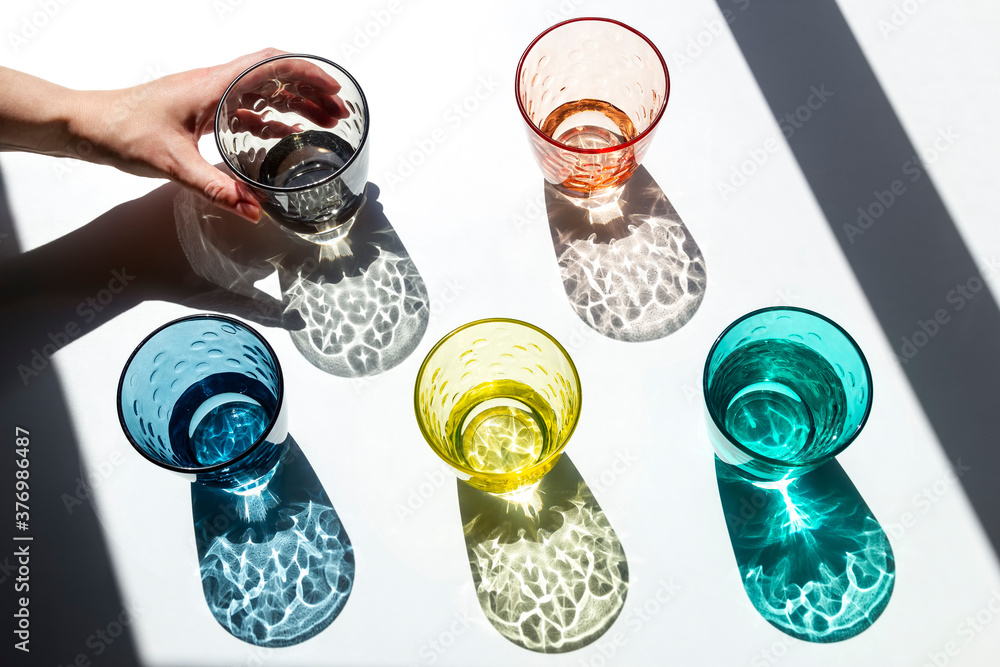 Overhead view of woman's hand holding glass Stock Photo | Adobe Stock