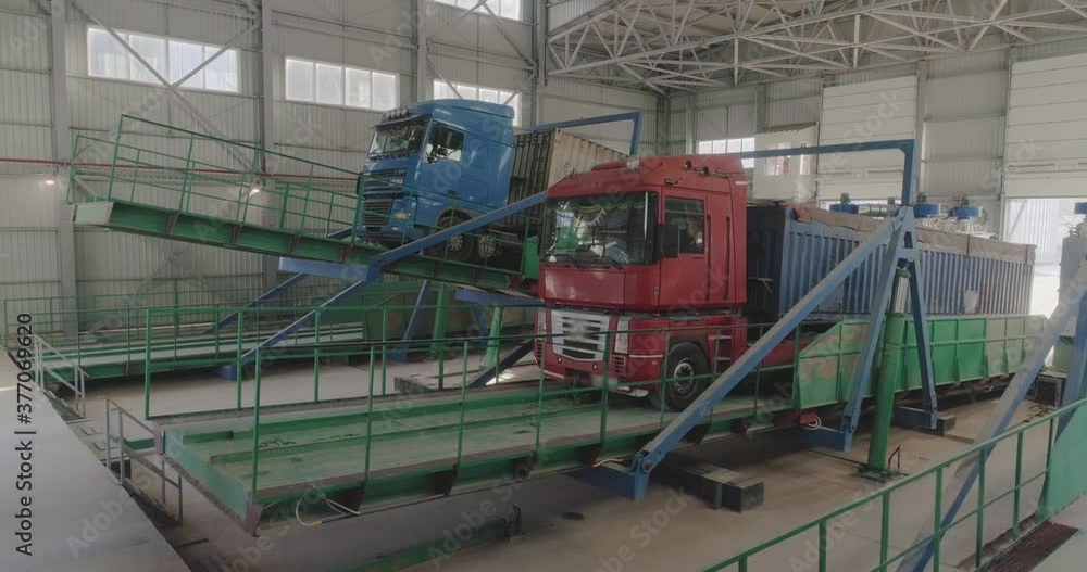 Loading wheat into an elevator. Unloading wheat from a truck to a silo ...