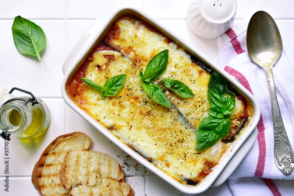 Italian eggplant dish melanzane alla parmigiana. Top view with copy ...