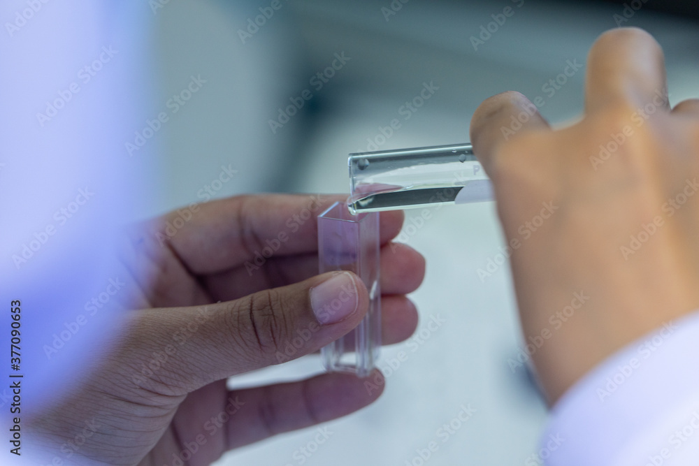 Sample analysis using Spectrophotometer for lab experiments. Stock ...