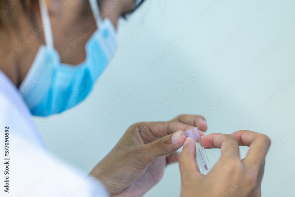 Sample analysis using Spectrophotometer for lab experiments. Stock ...