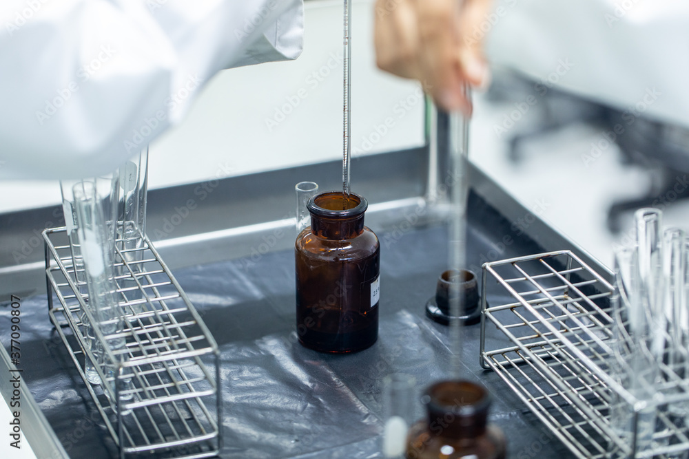 Sample analysis using Spectrophotometer for lab experiments. Stock ...