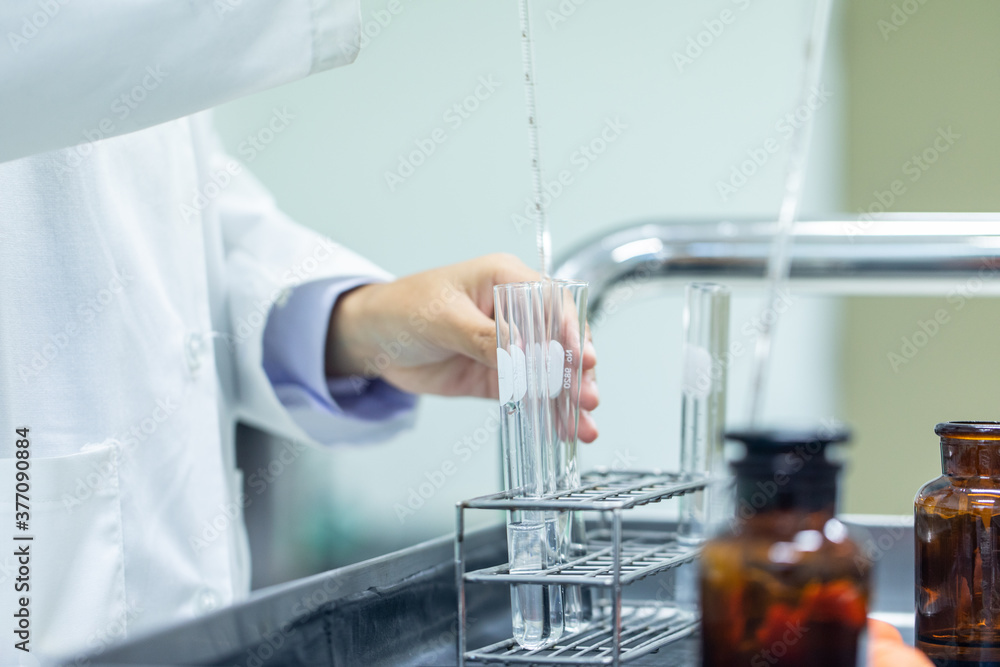 Sample analysis using Spectrophotometer for lab experiments. Stock ...