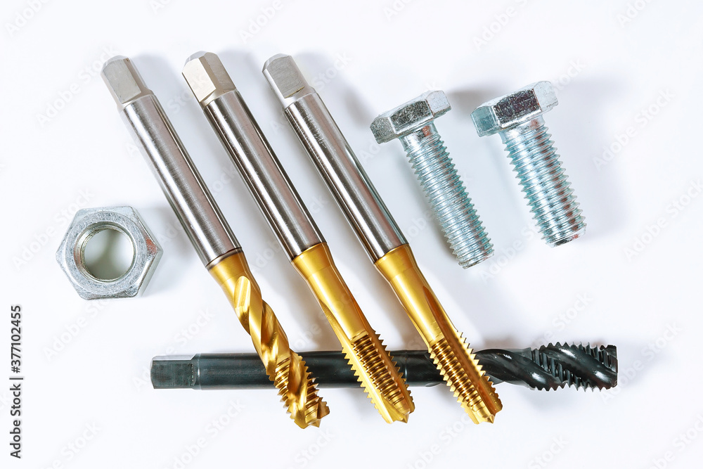 Set of tap for threading in metal. Bolts and nuts isolated on white ...