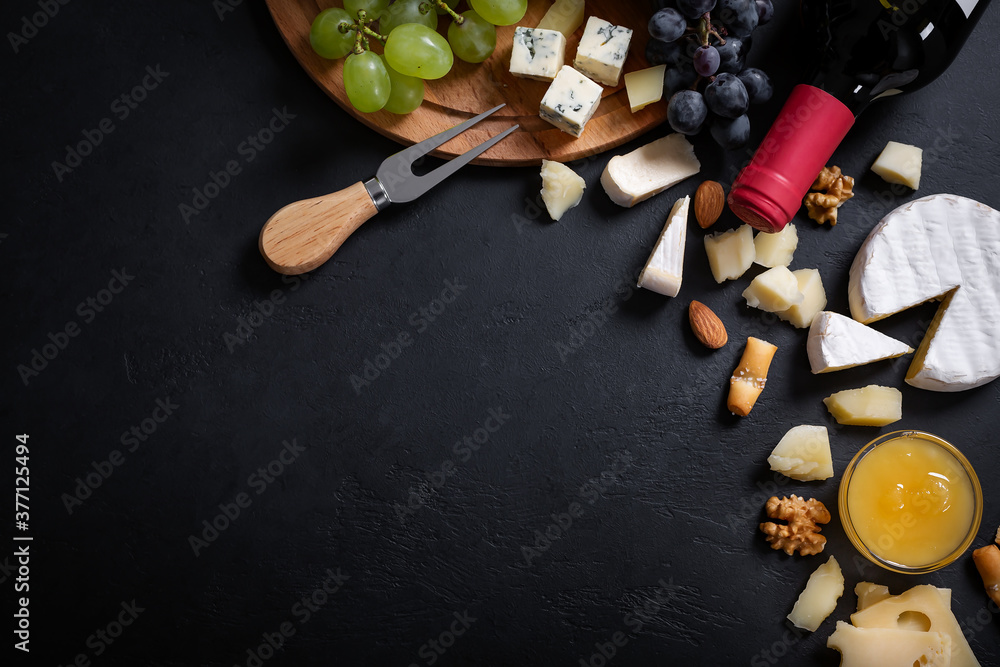 Menu frame with different types of cheese, honey, grapes and wine on ...