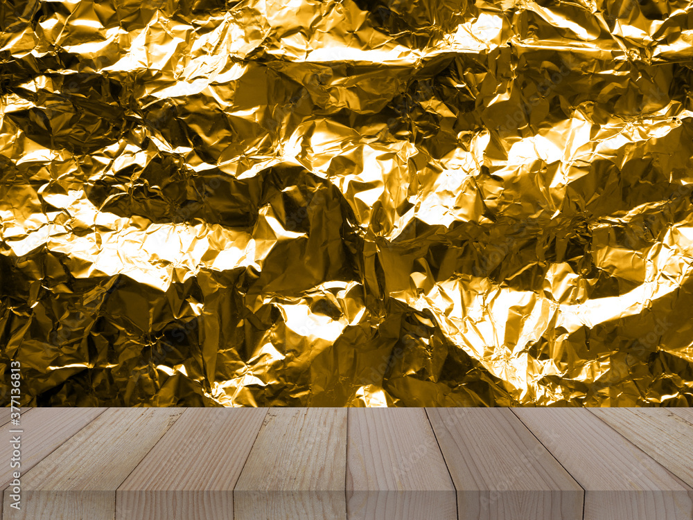 wood table on gold aluminium foil texture background for product ...