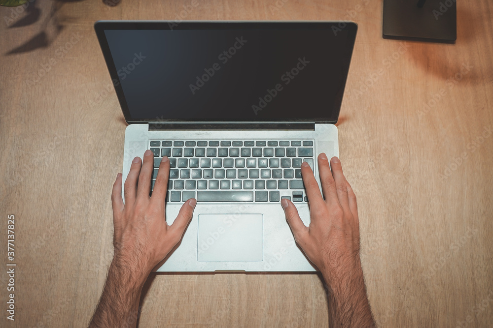 Laptop mockup. Male hand on a laptop keyboard black and white ready to ...