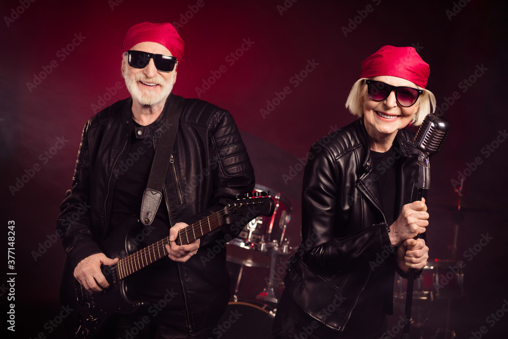 Photo of aged lady man popular old rock group family concert play solo ...