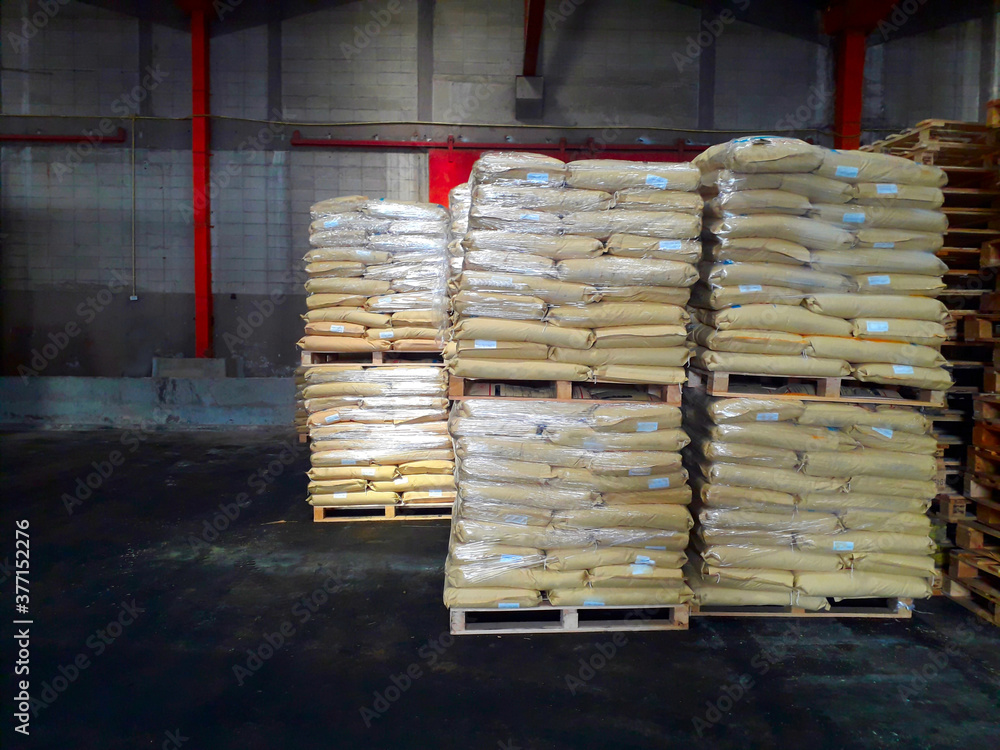 Chemical fertilizers Packed in stacked sacks with clear plastic wrapped ...