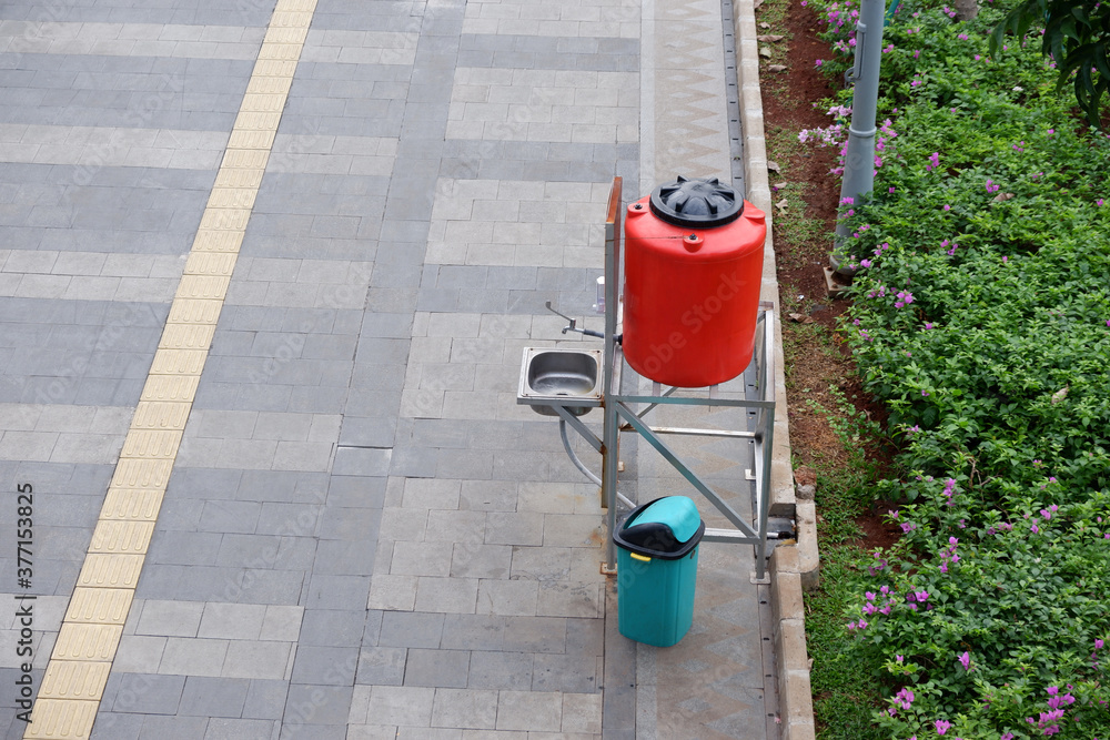 Public hand washing facilities on the sidewalk of Sudirman Street ...