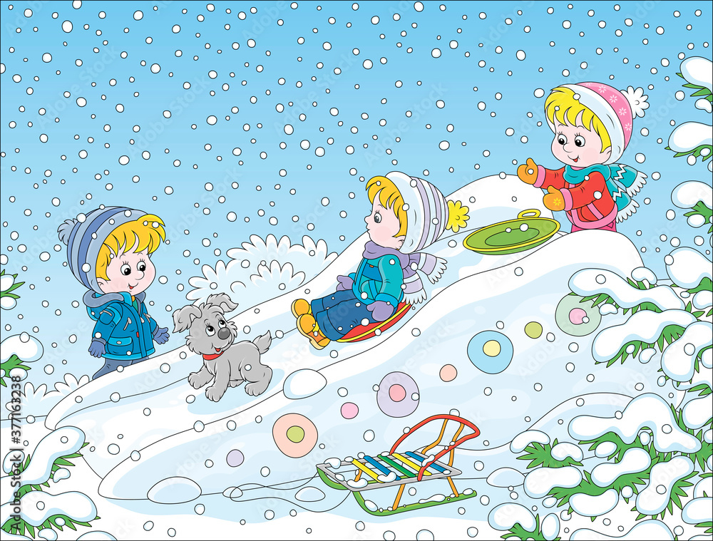 Children playing on an ice slide on a snow-covered playground in a ...