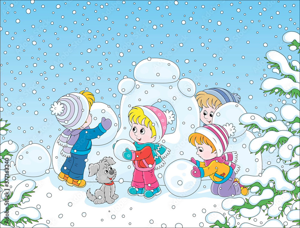 Small children building a snow fortress on a playground in a winter ...