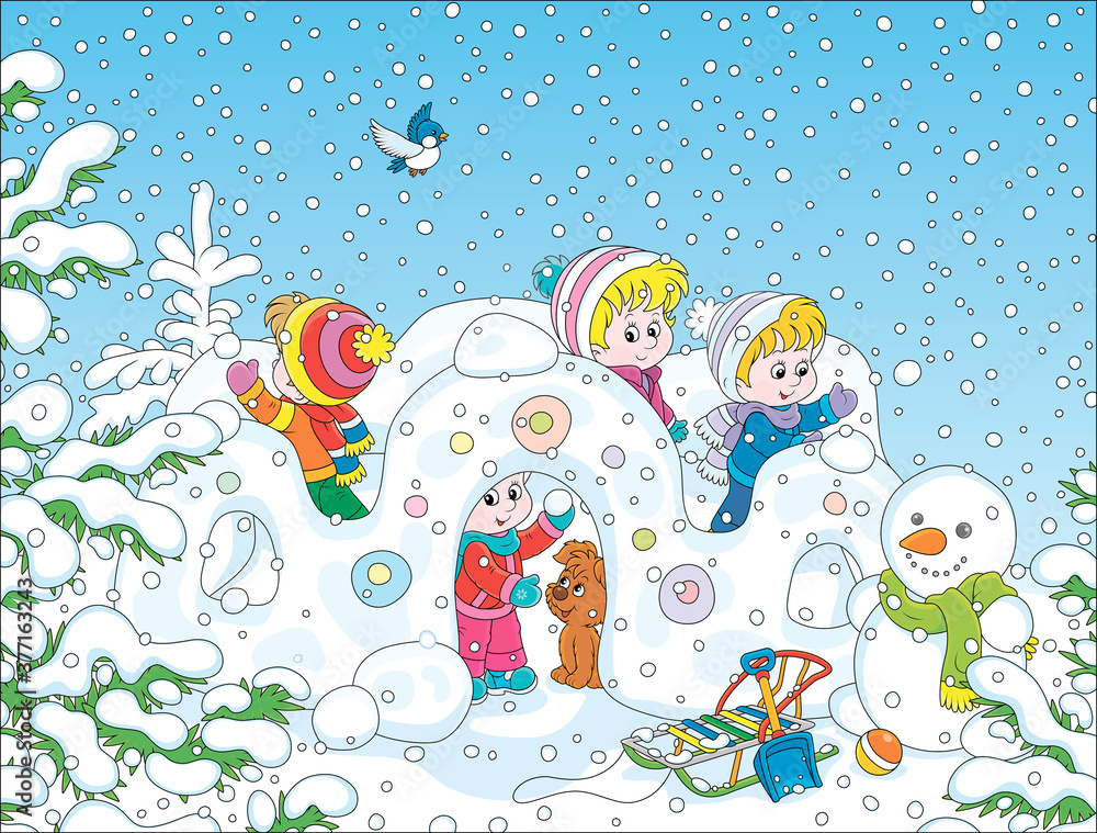 Small children playing in their toy snow fortress on a playground in a ...
