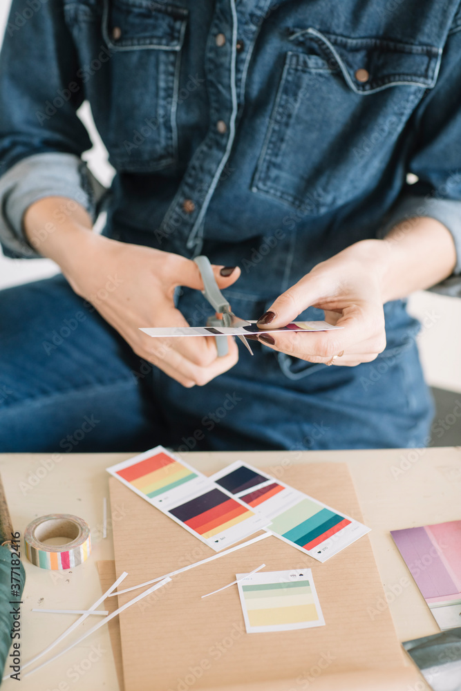 Anonymous Young Woman Cutting Pantone Colours For Moodboard Stock Photo ...