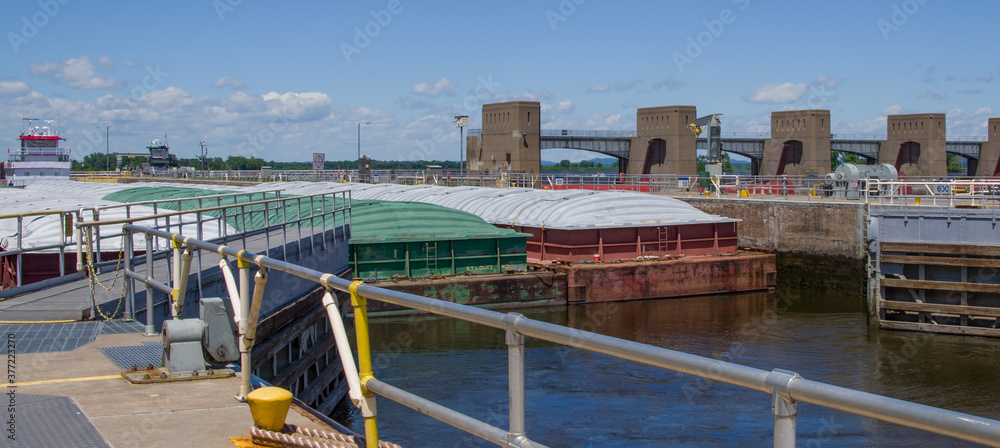 Lock Gates Opening: Exit gates swing inward, allowing a towboat to ...