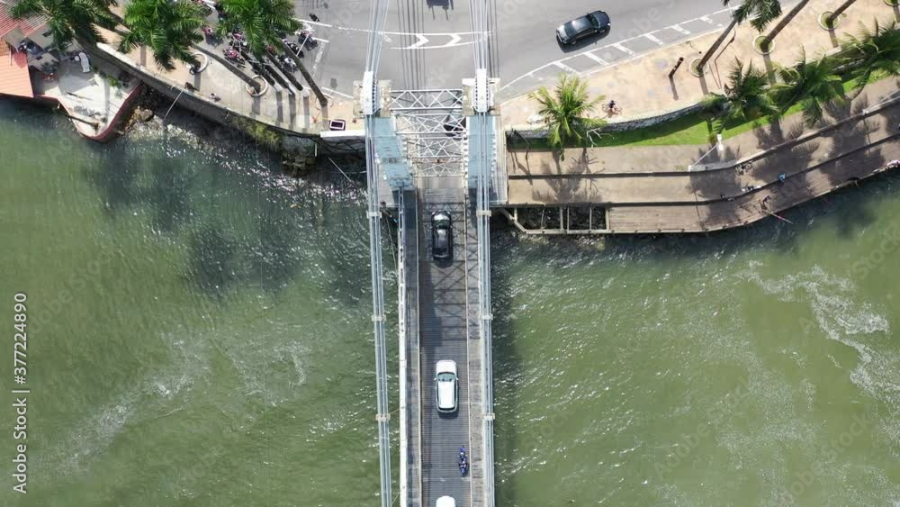 Suspension bridge above river view in Sao Vicente, Sao Paulo city ...