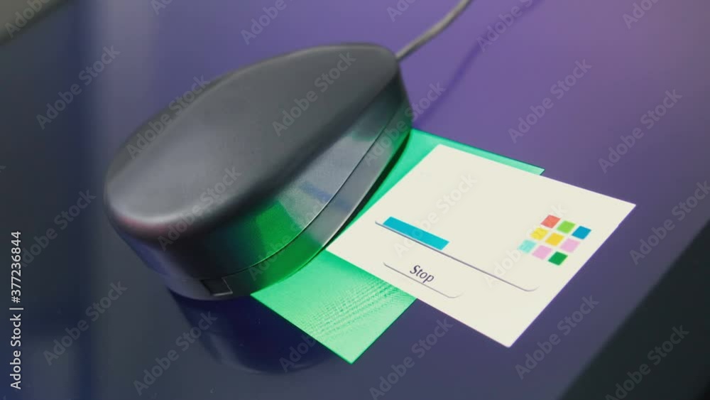 Professional calibration device measuring modern monitor colors. A ...