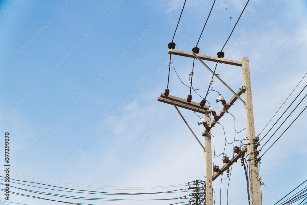 Electric high voltage drop fuse on electric pole with blue sky ...