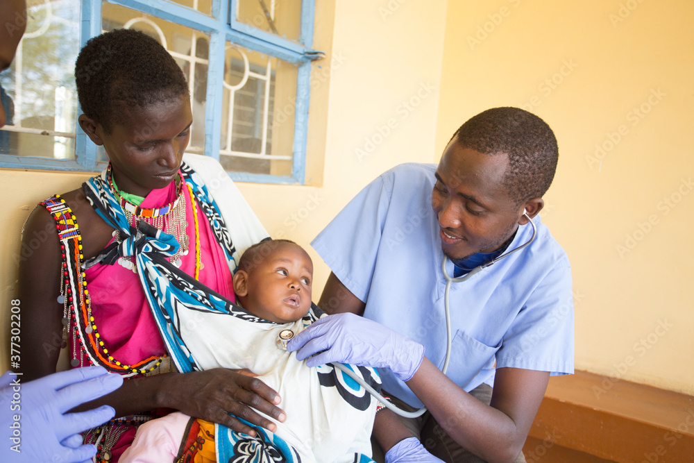 Doctors working with children in clinic. Kenya. Africa. Stock Photo ...