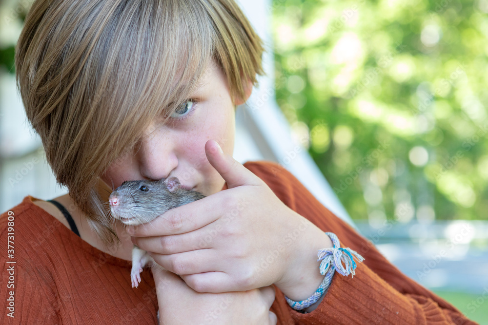 Cute Tween Girl kissing Pet Rat Stock Photo | Adobe Stock