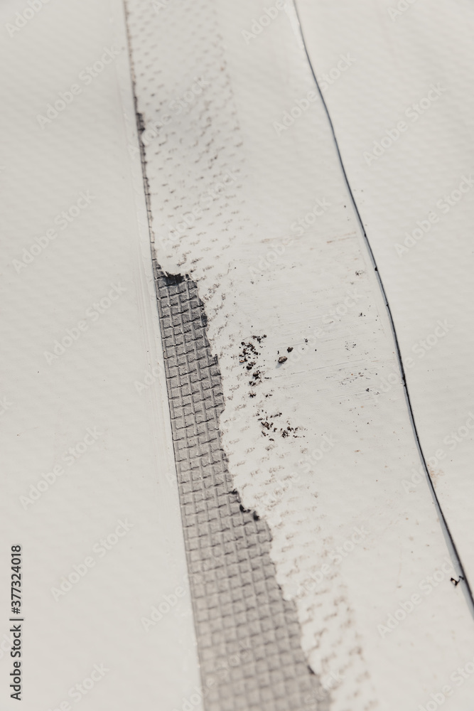 Pvc membrane roof damaged by resistance test Stock Photo | Adobe Stock