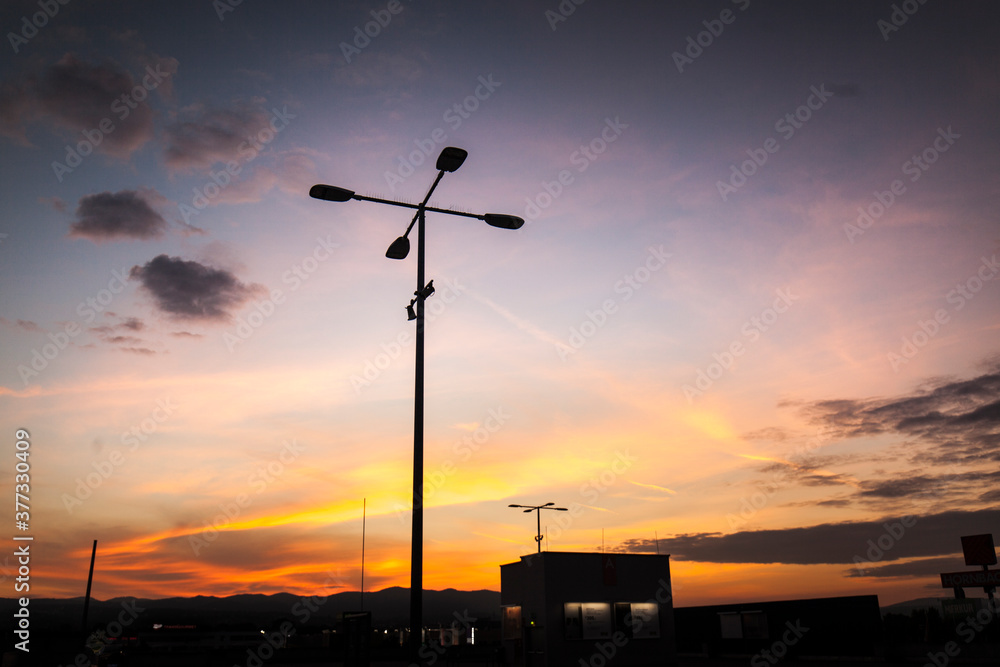 Street lamp with no light at sunset. Switched off street lamp in ...