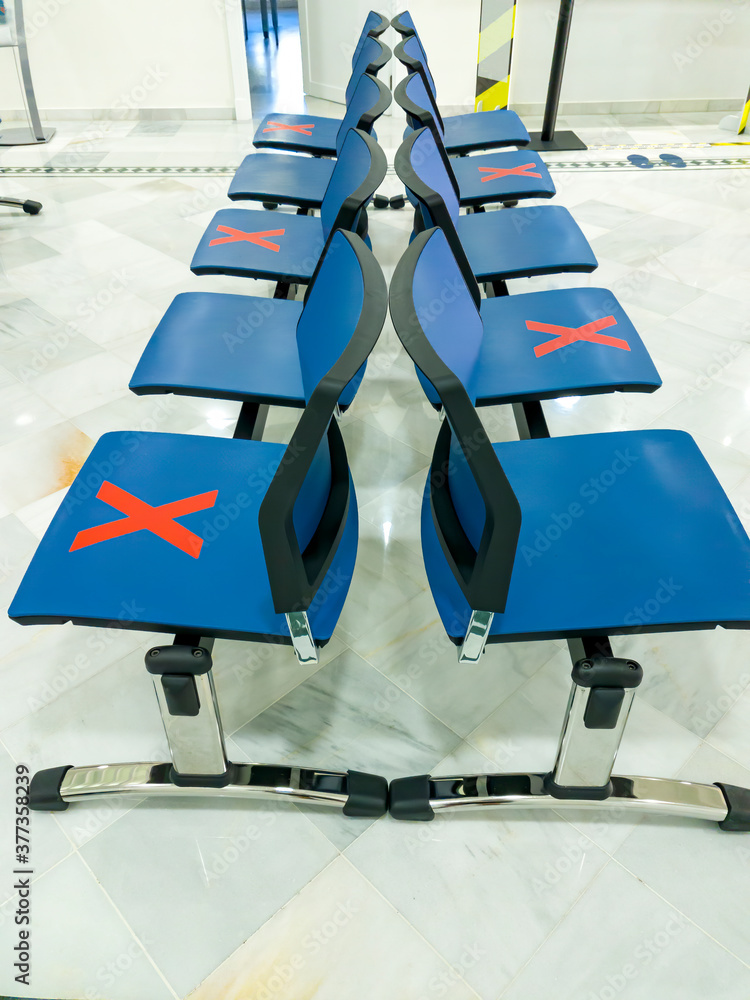 Social distancing. The waiting room of a hospital where is keeping ...