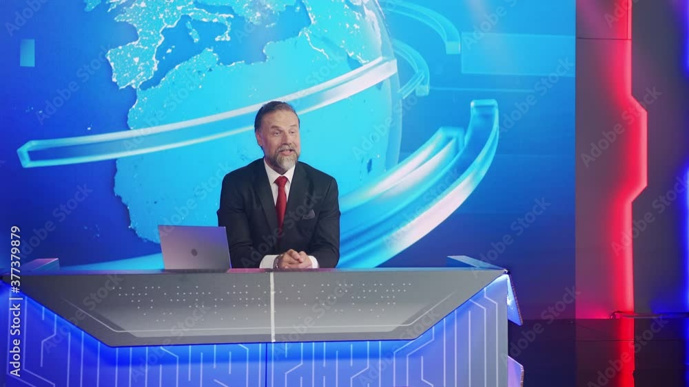 Live News Studio with Handsome Male Newscaster Reporting on the Events ...