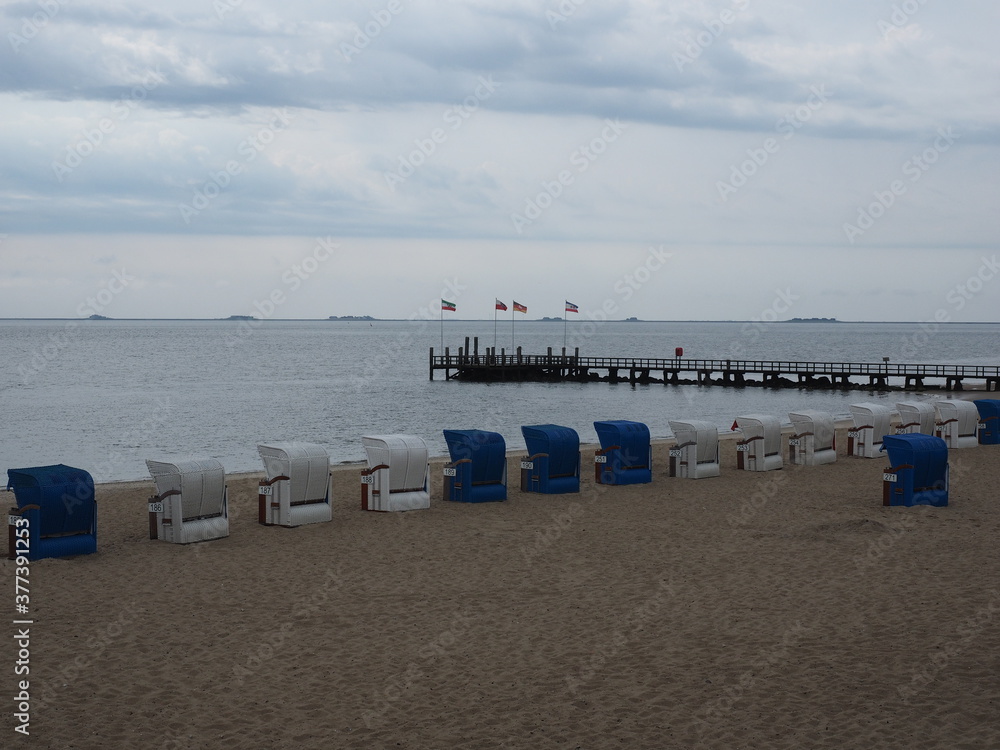 strandkoerbe am strand im sand Stock Photo | Adobe Stock