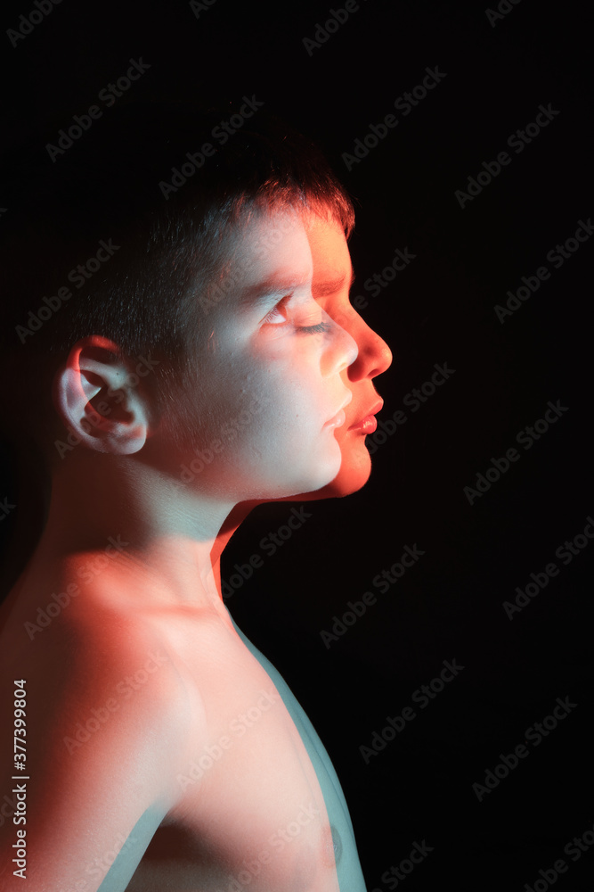 Side view of shirtless boy standing indoors Stock Photo | Adobe Stock