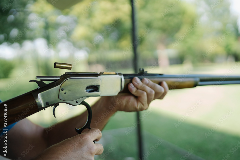 Mid Adult Man Training His Aim and Concentration Using a Shotgun in a ...