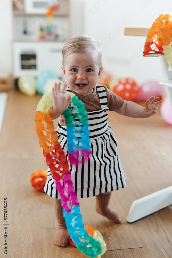 Adorable happy little girl playing with decoration Stock Photo | Adobe ...