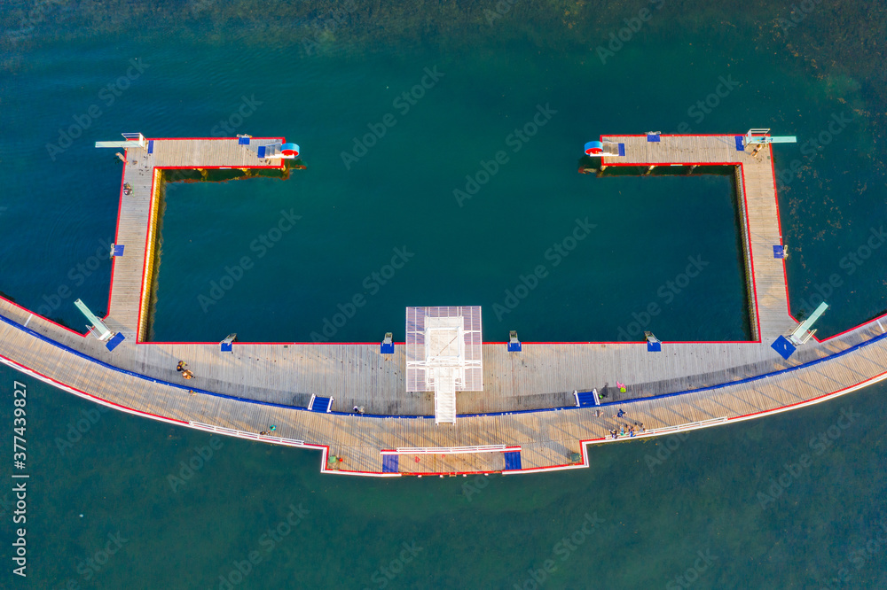 Aerial view of a large diving platform above a circular swimming ...
