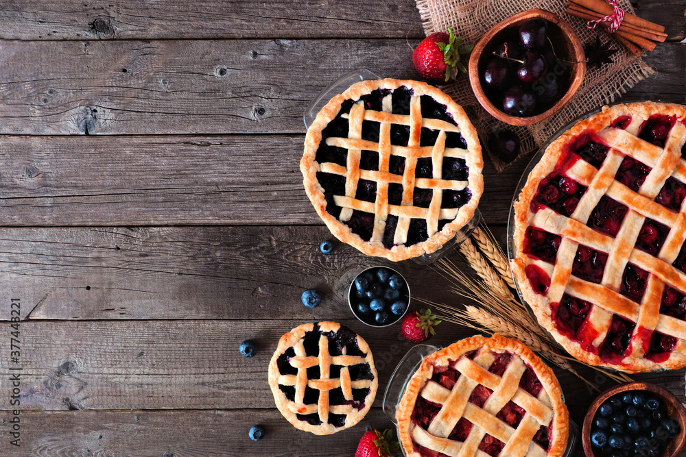 Variety of homemade fruit pies. Top down view over a dark wood ...