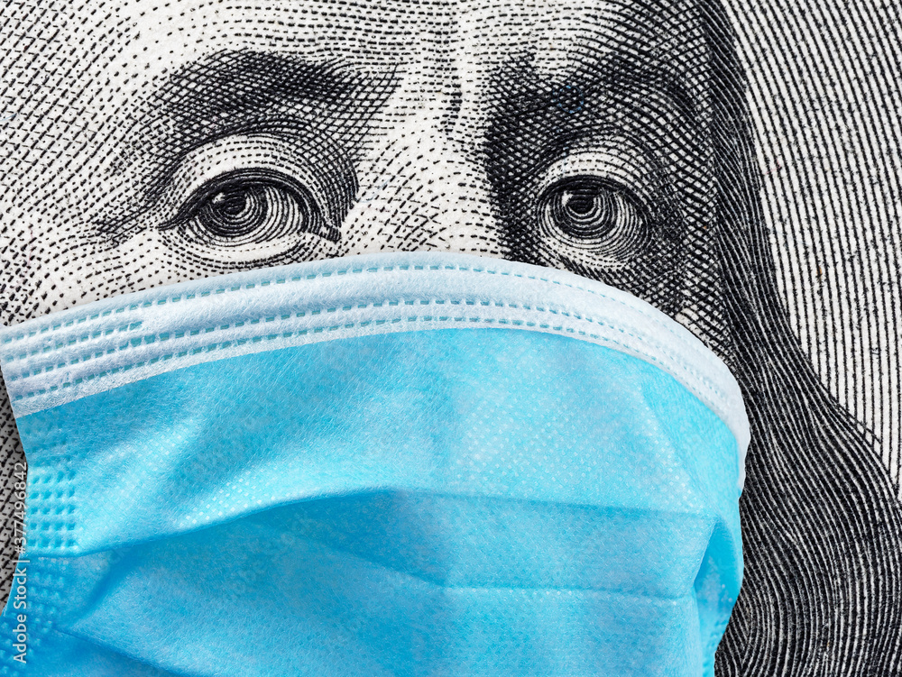 Macro 100 dollar bill shows Benjamin Franklin wearing a surgical mask ...