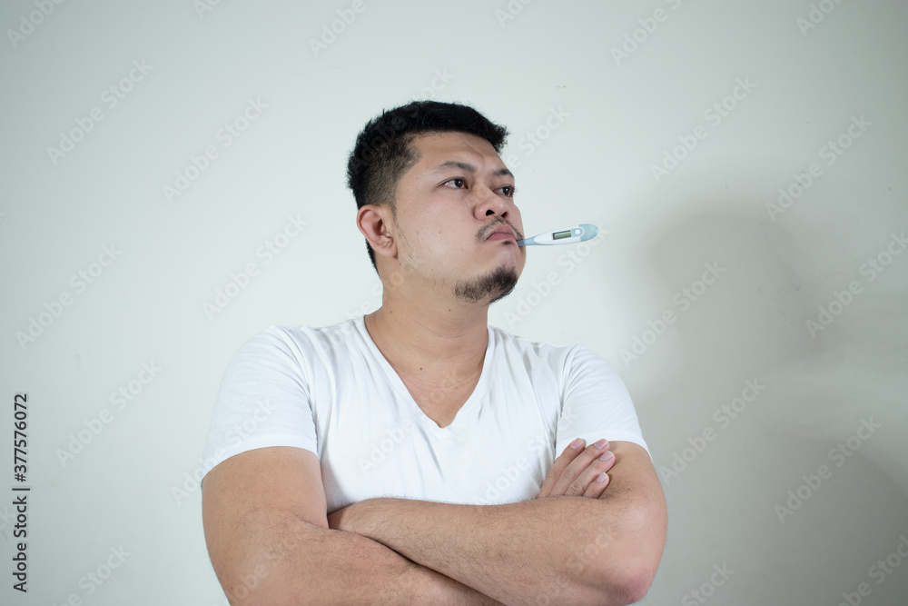 People Healthcare And Fever Concept Unhealthy Asian Man Measuring