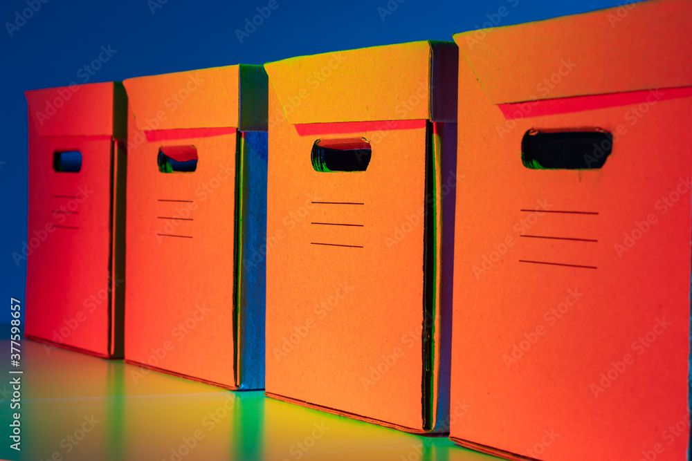 Four close-up document storage boxes. Storage of paper archives ...